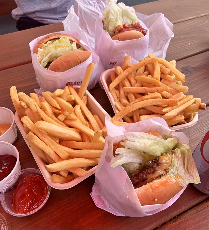 The Apple Pan's burger-and-fries combo comes wrapped in paper like a present your stomach has been waiting to unwrap all day. No fancy plating required when the food speaks this loudly.