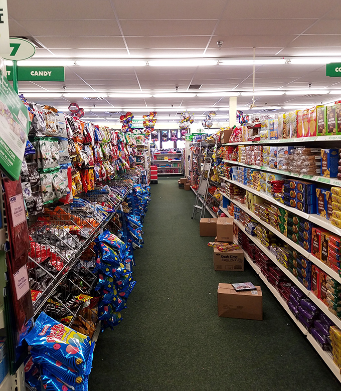 Snack attack headquarters where impulse buys don't require financial regret. From familiar favorites to curious imports, this aisle is a road trip provisioner's dream.
