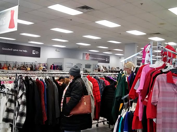 A shopper navigates the winter coat section with the focus of an archaeologist. The perfect find requires patience and a trained eye.