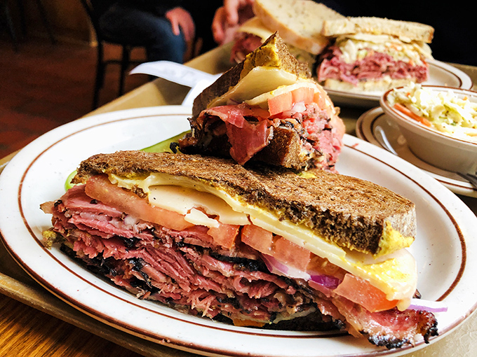 Architecture students should study this sandwich. The structural integrity required to support these towering layers of meat and cheese is nothing short of engineering brilliance.
