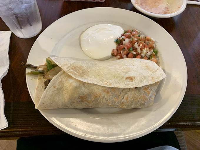 Behold the steak burrito in all its glory! Perfectly grilled meat peeks out from its tortilla cocoon, ready to transport you to flavor paradise.