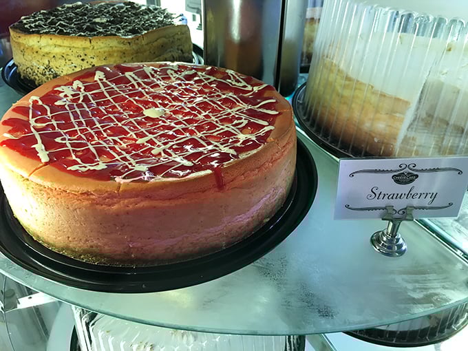 Strawberry cheesecake with its ruby-red topping and delicate white drizzle &ndash; nature and artistry collaborating on a dessert that belongs in the Louvre.