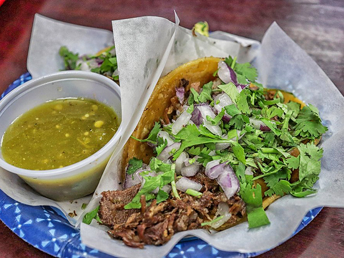 Simple yet profound: fresh cilantro, onions, and perfectly seasoned meat on corn tortillas. Sometimes the classics need no improvement.