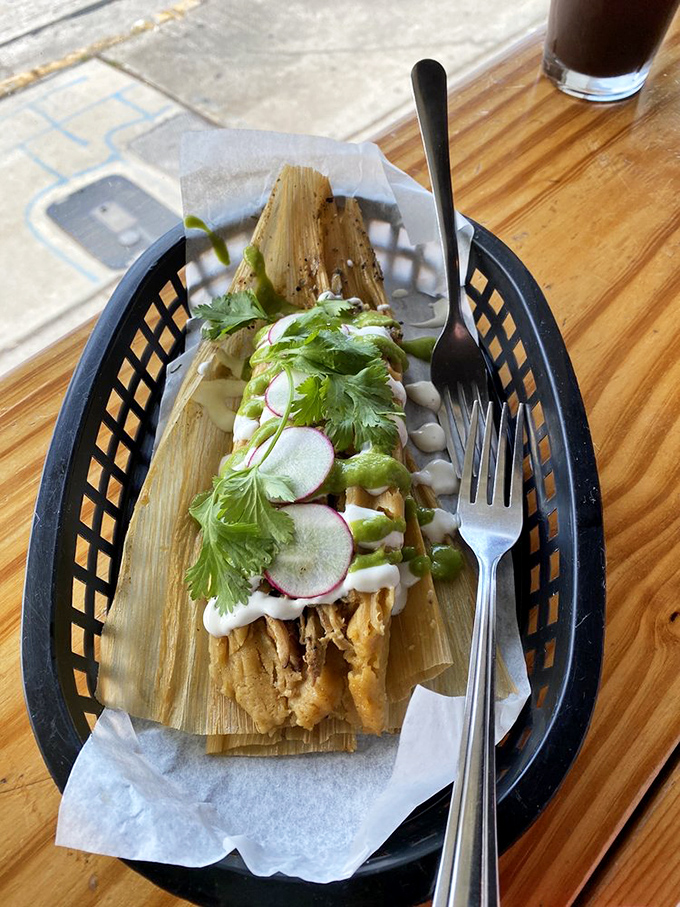 Not all heroes wear capes; some come wrapped in corn husks. This tamale is what comfort food dreams are made of.