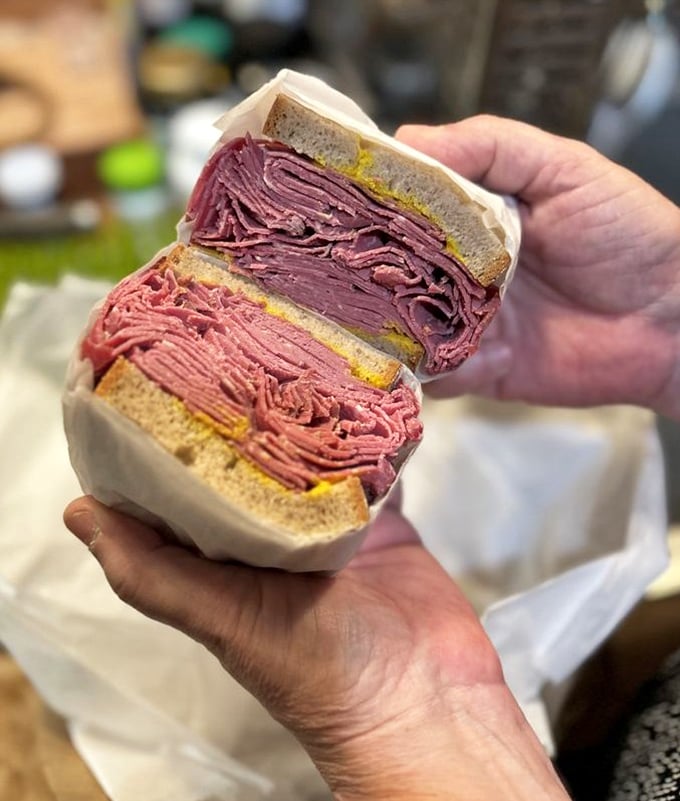 The cross-section reveals the truth: this isn't just a sandwich, it's a masterpiece of proportion. Each component plays its role in perfect harmony.