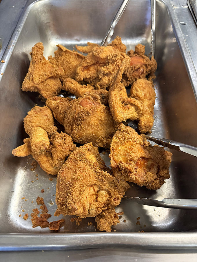 The buffet tray that launches a thousand road trips. Each piece of chicken promises a perfect crunch-to-juicy ratio that'll haunt your dreams.