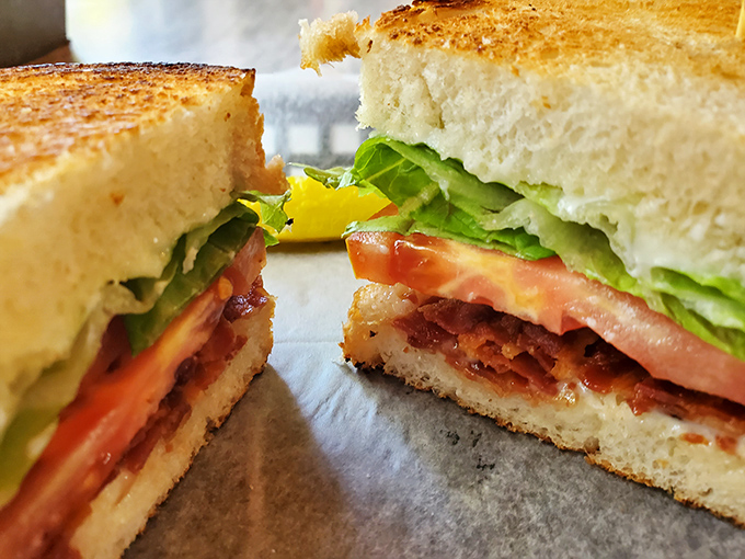 The "You're Bacon Me Crazy" sandwich lives up to its punny name—crispy bacon, garden-fresh veggies, and bread toasted to golden perfection.