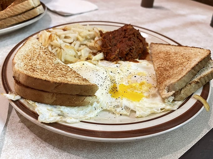 The classic two-eggs breakfast with hash browns and toast&mdash;proof that sometimes the simplest combinations create the most profound satisfaction.
