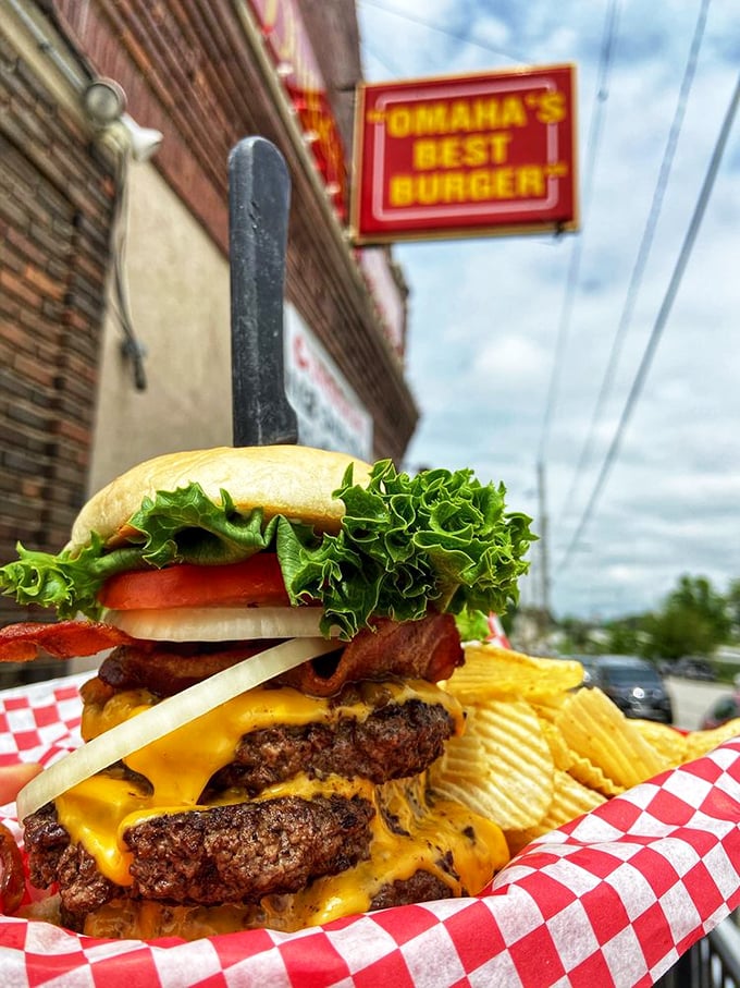 The Triple Decker in its natural habitat. This isn't just a burger&mdash;it's a skyscraper of flavor demanding your full attention.