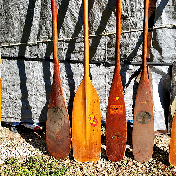 These weathered wooden paddles tell stories of river adventures past. One man's forgotten boat equipment becomes another's rustic wall d&eacute;cor.