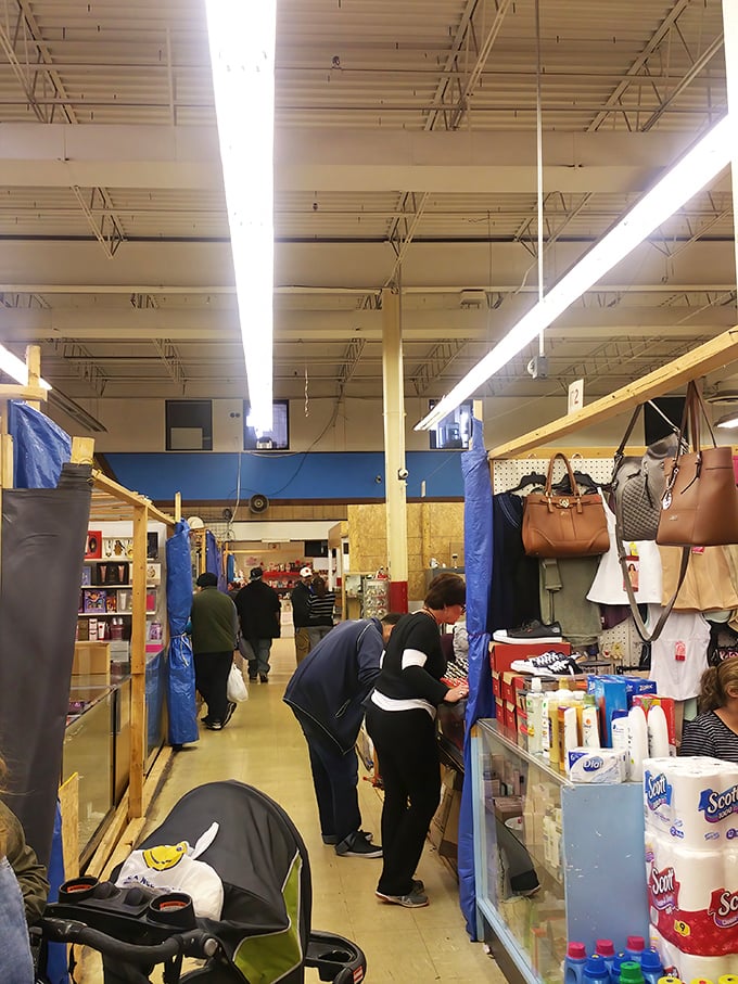 The narrow aisles become impromptu community spaces where shoppers hunt for bargains among household essentials and designer handbags alike.