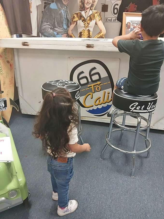 Young explorers discovering Route 66 magic at the counter. Each vintage stool holds the promise of adventure for the next generation of road warriors.