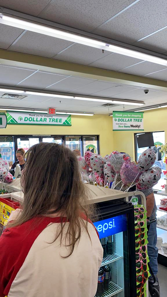 The checkout experience: where shoppers clutch their treasures and the "Do You Want A Bag?" sign reminds us of life's important questions.