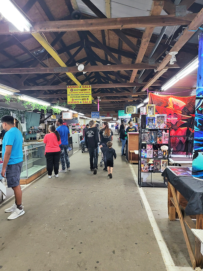 Family expeditions in progress! Multi-generational treasure hunters navigate the indoor aisles, where fluorescent lights illuminate decades of American culture.