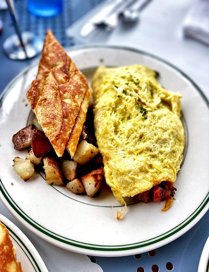 This isn't just an omelet; it's a yellow cloud of possibility. Paired with that triangle of sourdough toast, it's San Francisco's answer to breakfast diplomacy.
