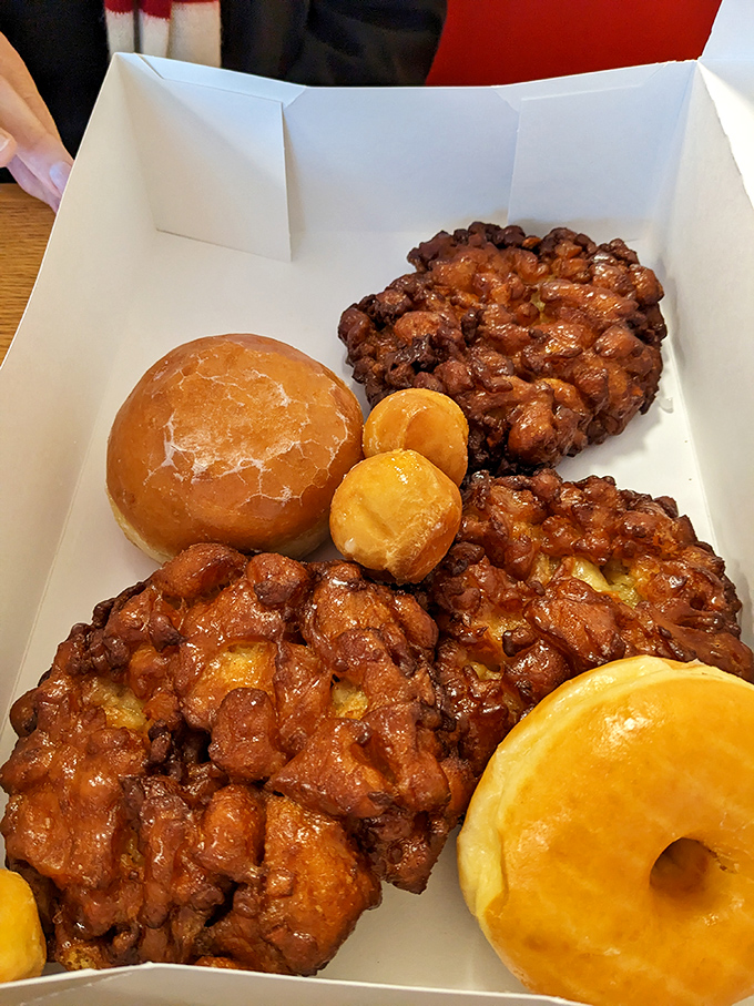 Apple fritters: where "portion control" goes to die. These magnificent monsters combine crispy edges, tender centers, and chunks of cinnamon-kissed apples in perfect harmony.