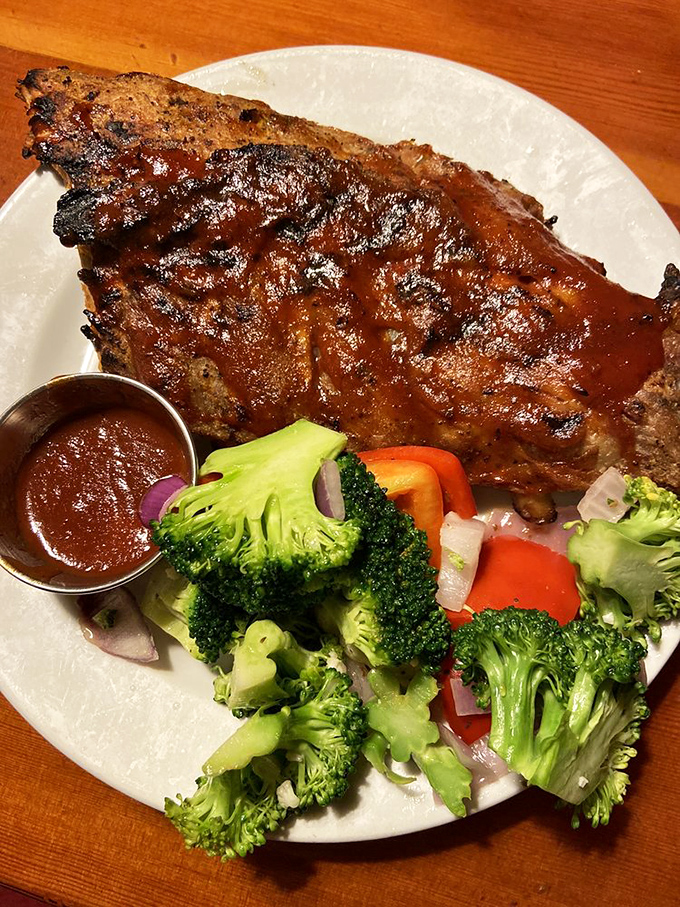 Baby back ribs glazed with sauce that should be illegal in at least seven states. The vegetables are just there to make you feel virtuous.