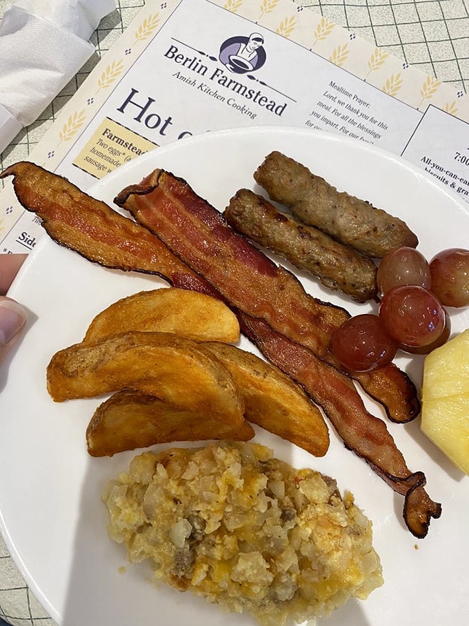 A breakfast plate that speaks the universal language of "good morning" &ndash; crispy bacon, golden home fries, and hash brown casserole that demands to be savored, not rushed.