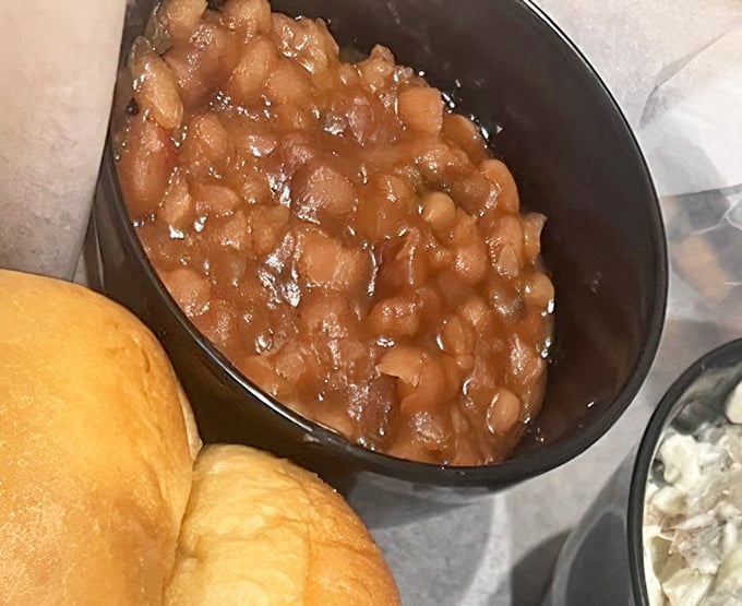 These baked beans aren't just a side dish&mdash;they're a sweet, savory symphony that's been simmering its way to perfection alongside that golden roll.