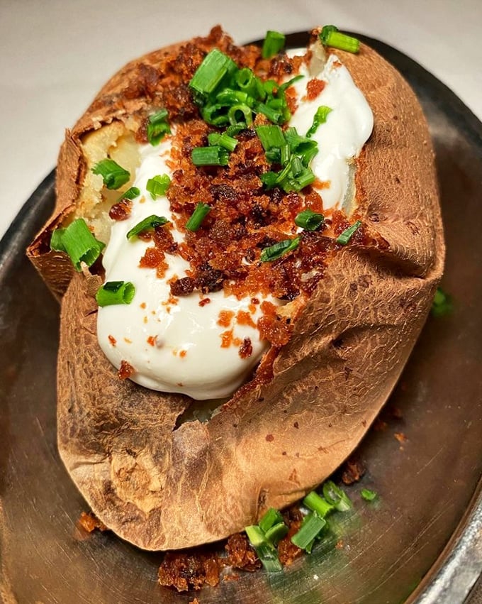 Not just any baked potato&mdash;this loaded beauty comes dressed for the occasion with all the fixings. Potato perfection that makes French fries jealous.