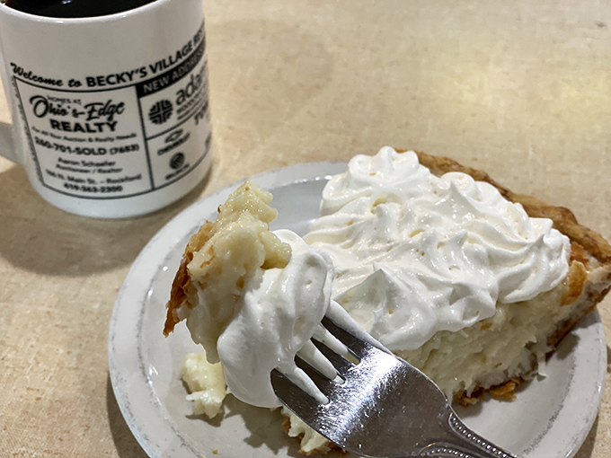 Banana cream pie that would make your grandmother both proud and jealous. The fork's already halfway to heaven.