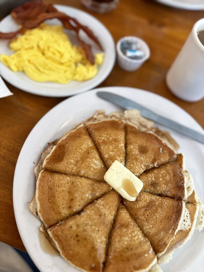 These pancakes aren't just cooked; they're engineered for maximum butter-melting capacity, with each wedge ready for its maple syrup bath.
