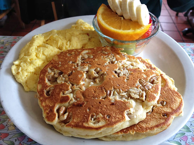 Walnut pancakes with the perfect golden-brown hue, flanked by scrambled eggs and fresh fruit&mdash;the breakfast equivalent of hitting a royal flush.