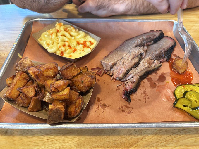 Brisket with that perfect smoke ring, mac and cheese that demands respect, and potatoes that didn't die in vain.