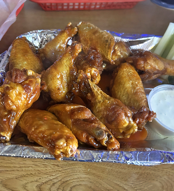 Wing perfection isn't complicated: crispy exterior, juicy interior, and sauce that demands an extra napkin or three. Simple pleasures done right.