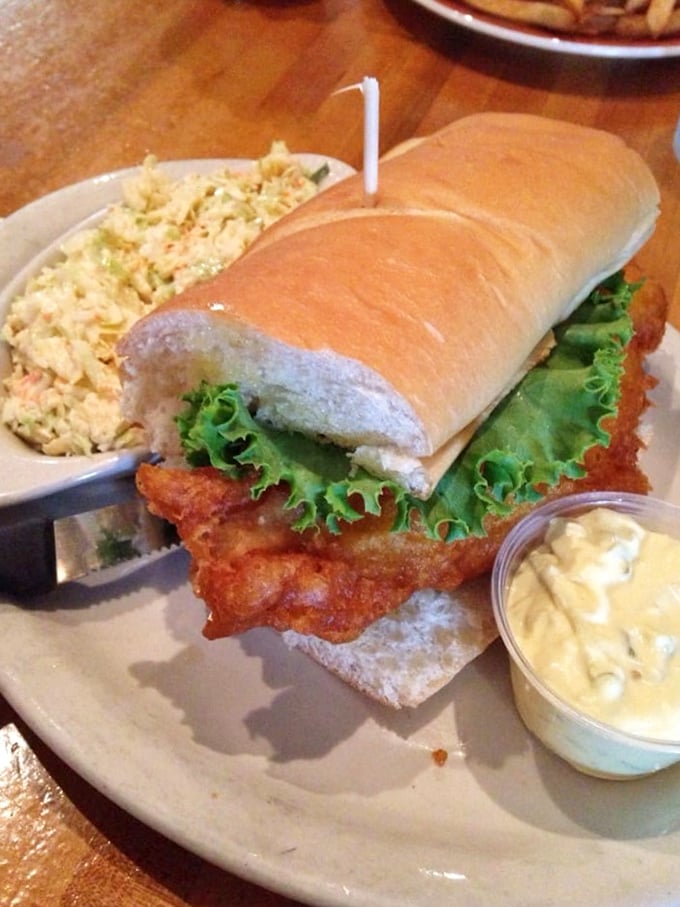 This catfish sandwich isn't just a meal, it's an event. Crispy, golden-brown perfection nestled in a pillowy bun with creamy slaw alongside.