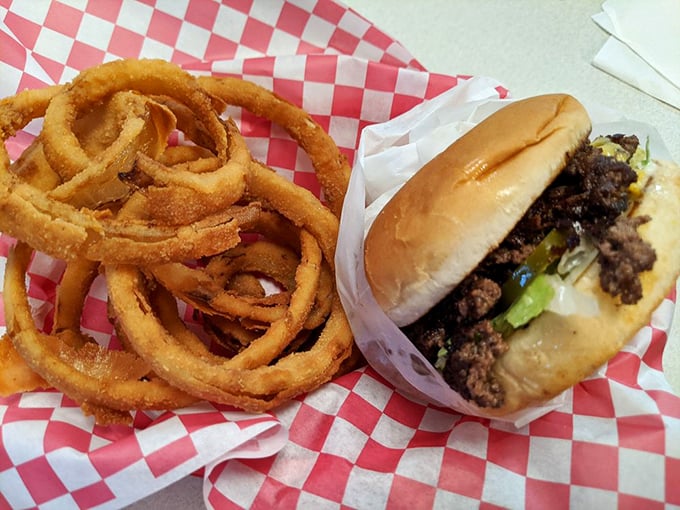 The golden-brown onion rings form perfect halos around a burger that would make angels sing.