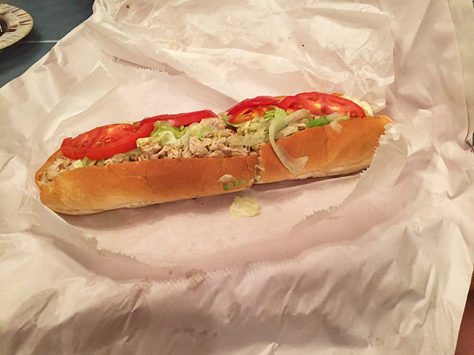 Behold the star attraction: a chicken cheesesteak dressed "all the way" with fresh lettuce and tomato&mdash;proof that perfection doesn't require fancy ingredients.