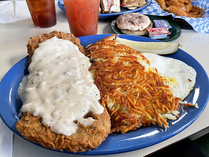 This isn't just chicken fried steak&mdash;it's a golden-crusted masterpiece with hashbrowns so crispy they deserve their own fan club.