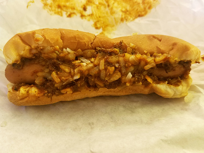Behold the humble chili dog, dressed with onions and nestled in a soft bun&mdash;proof that sometimes the classics are classics for good reason.