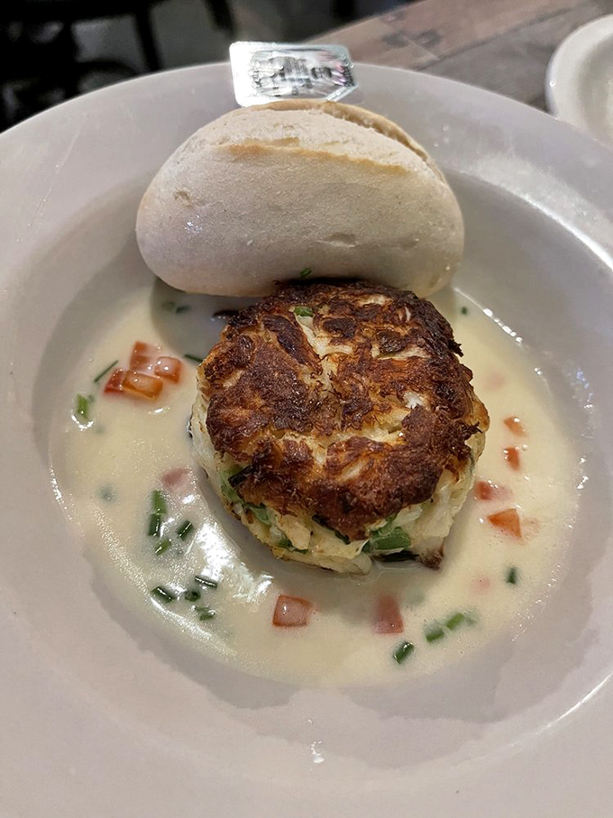 The star attraction: a perfectly golden crab cake bathed in lemon beurre blanc. Almost too beautiful to eat. Almost.
