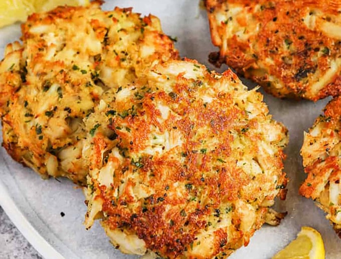 These golden-brown crab cakes aren't just fried, they're fulfilling a delicious destiny&mdash;crispy exterior giving way to tender, herb-flecked seafood treasure.
