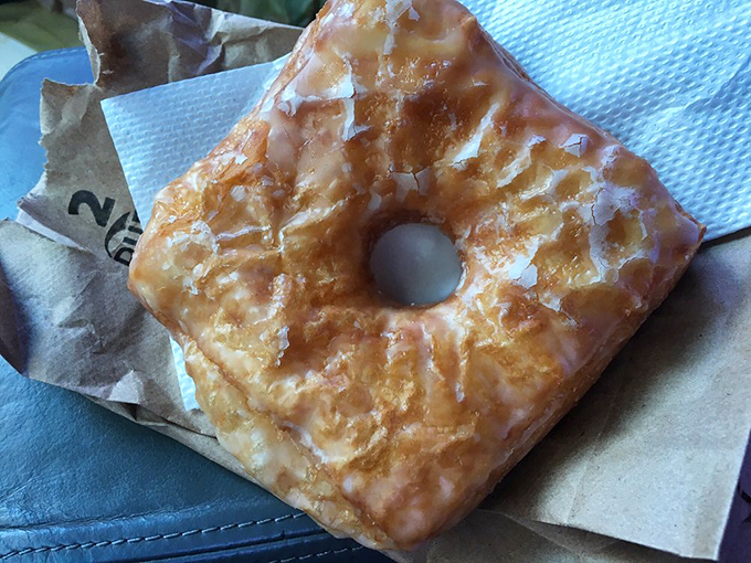 Behold the croissant donut in its flaky, golden glory. If Michelangelo sculpted breakfast pastries instead of marble, this would be his David.