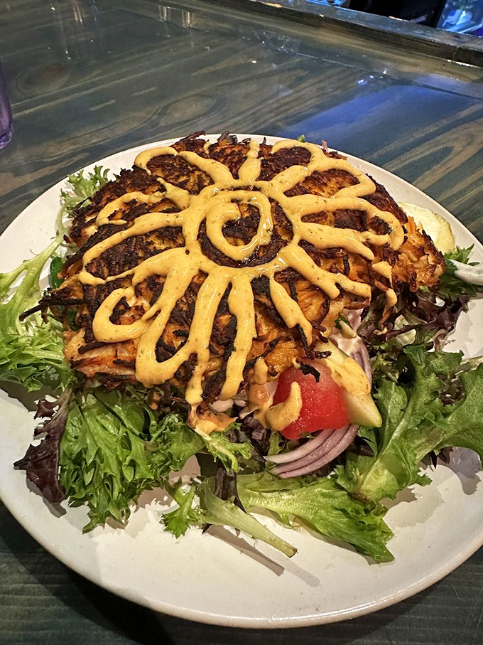 The signature sweet potato-crusted fish arrives like edible sunshine, complete with a sauce artfully drizzled to mimic Florida's brightest star.