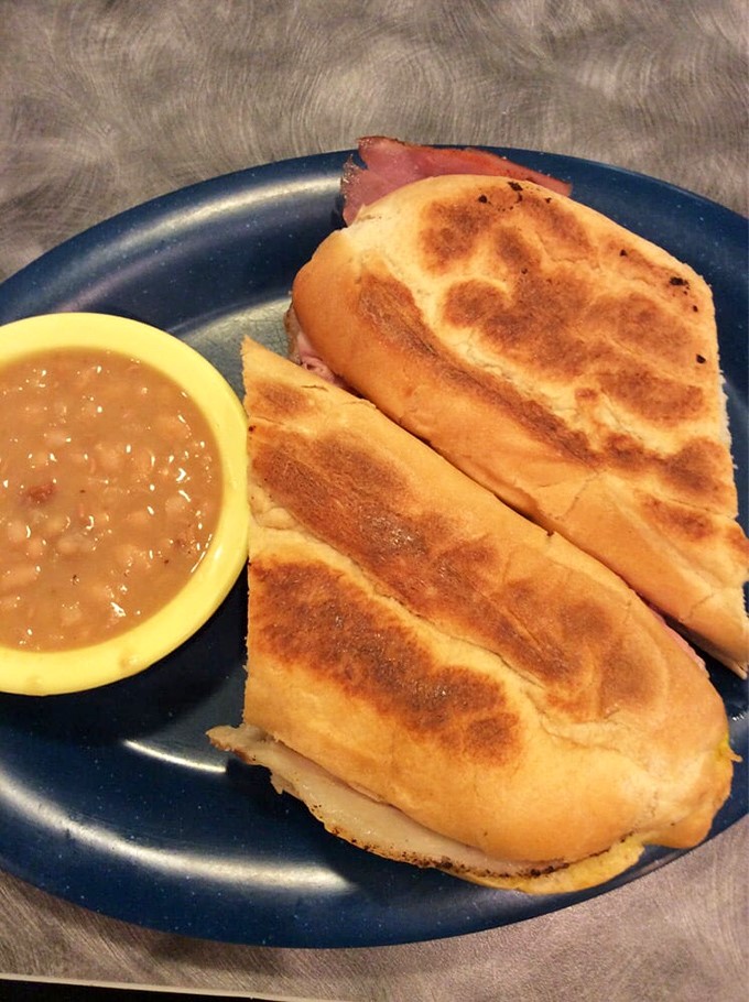 A proper Cuban sandwich should require both napkins and commitment&mdash;this golden-pressed beauty delivers with ham, pork, and just the right balance of mustard tang.