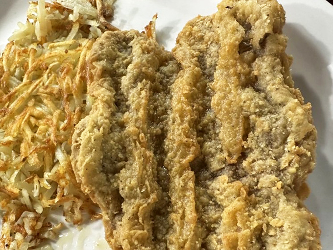 Behold the golden glory that is Fast Eddie's fish fry &ndash; crispy perfection that'll make you question everything.