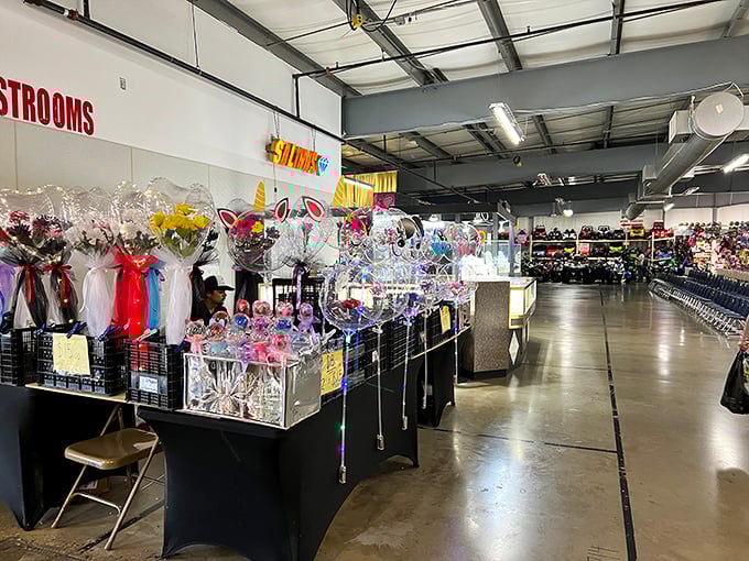 A burst of color and fragrance greets shoppers as they navigate past delicate blooms and festive decorations—proof that beauty thrives even indoors.