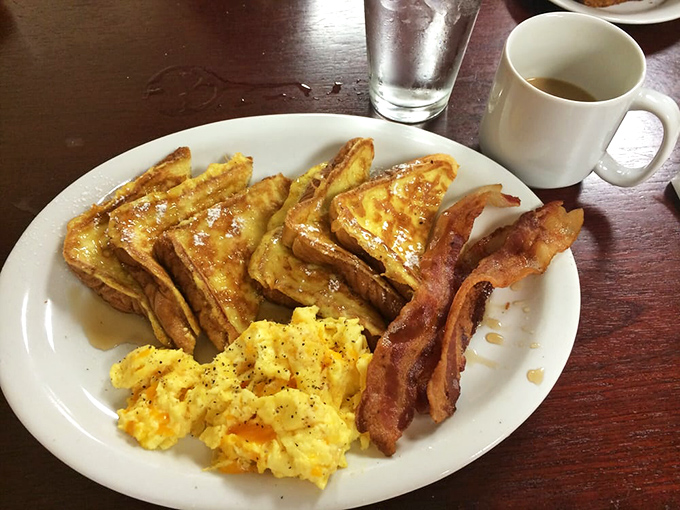 French toast that's achieved that mythical balance &ndash; crispy edges, custardy centers. The kind of breakfast that makes you forgive Monday for existing.