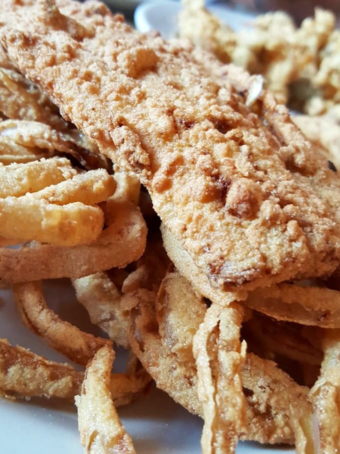 This isn't just fried fish&mdash;it's edible architecture. The perfect golden crust protecting tender white fish is engineering you can eat.