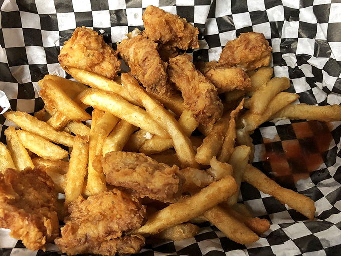 Golden-fried perfection meets French fries in a basket that screams "vacation calories don't count!" Crispy comfort at its finest.