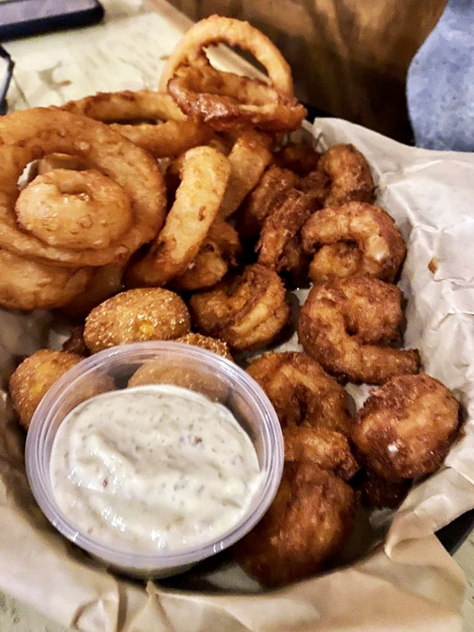 Golden fried shrimp and onion rings create a symphony of crunch that would make Colonel Sanders jealous.