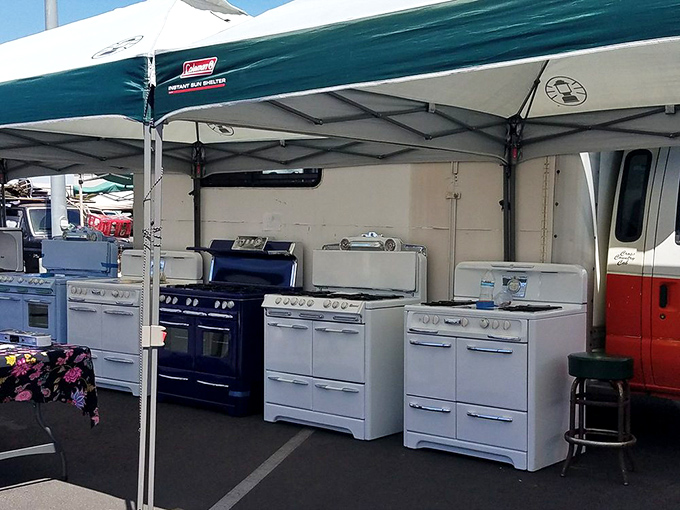 The vintage stove lineup looks like a 1950s appliance showroom frozen in time. Your grandmother would recognize every knob and dial.