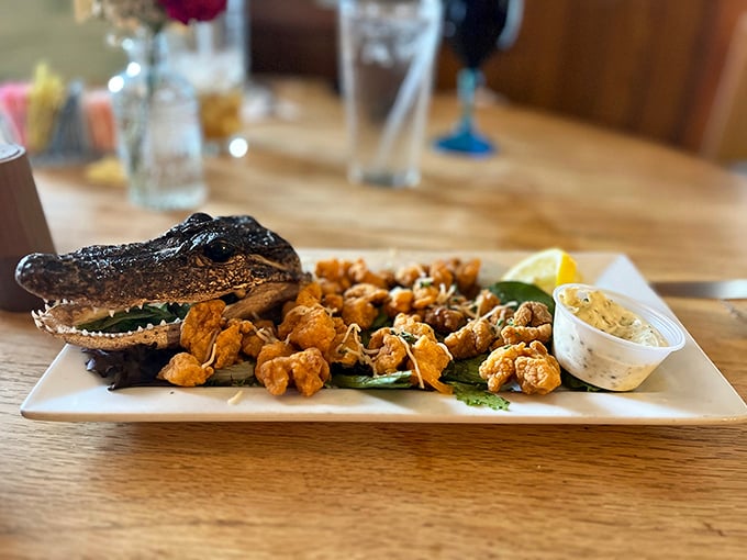 Florida on a plate! This alligator presentation is both terrifying and terrific &ndash; crispy bites served with their former owner keeping watch.