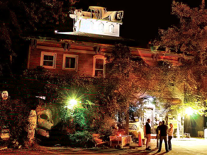 As twilight embraces this historic building, the warm glow of lights transforms an ordinary evening into something magical&mdash;small-town enchantment at its finest.