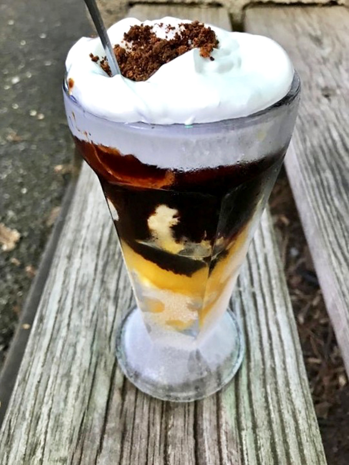 Layers of ice cream, chocolate, and caramel create a parfait that's part architecture, part dessert. Spoon required, restraint optional.