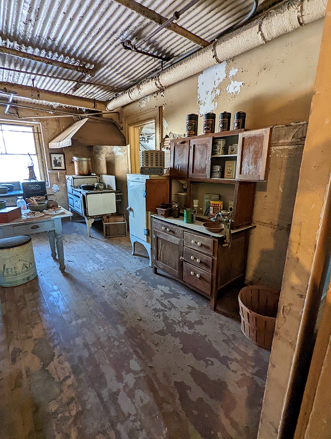 The institutional kitchen, with its vintage appliances and worn wooden cabinets, once fed hundreds daily&mdash;a far cry from today's celebrity chef kitchens but no less fascinating.